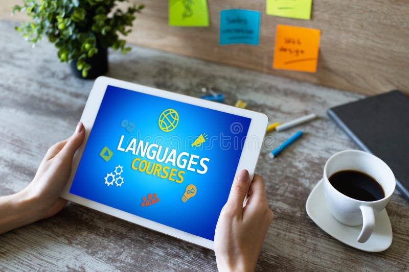 Tablet with Languages Courses Text and Icons on Screen. English ...