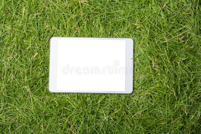 Tablet Lying on the Green Grass Stock Image - Image of field, grass ...