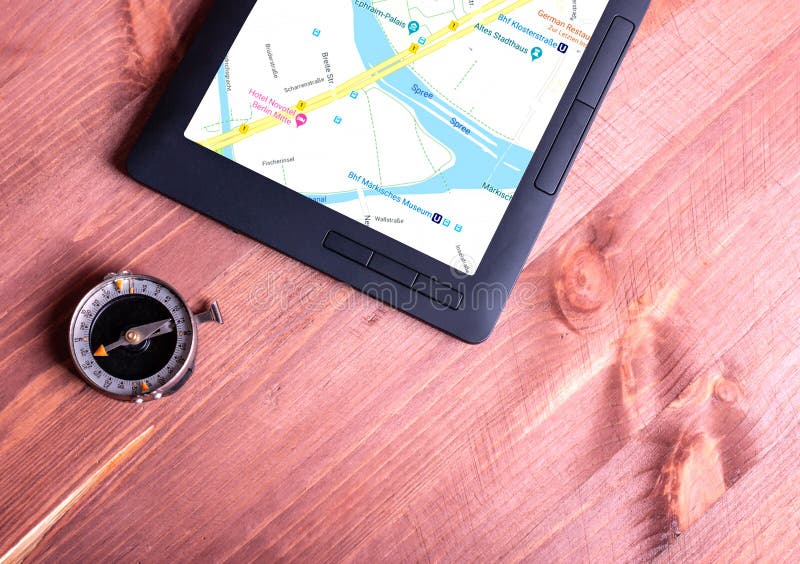 Tablet with Navigation Map and Compass on Wooden Background Stock Photo ...