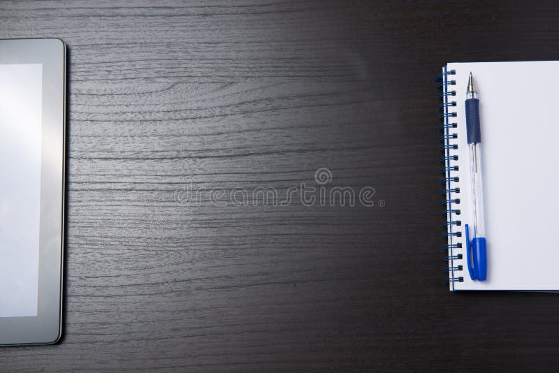 Tablet with Notebook and Pen on Dark Table Stock Photo - Image of ...