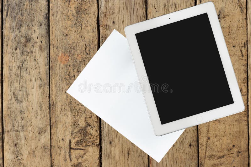 Tablet and Paper on Wood Table Stock Photo - Image of ereader, paper ...