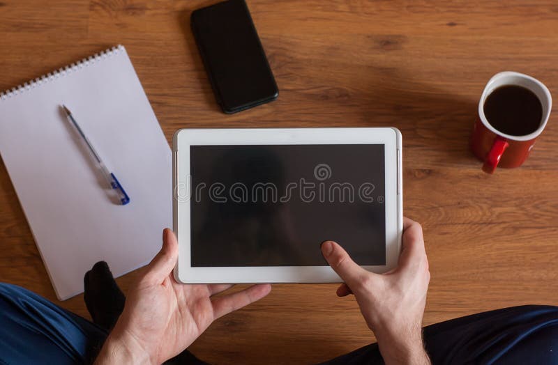 Tablet PC with Black Screen in the Hands, Cup of Tea, Phone and ...