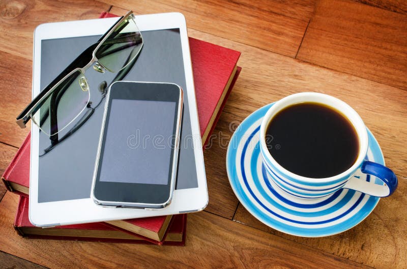 Tablet Pc and a Coffee and Mobile Phone Stock Image - Image of table ...