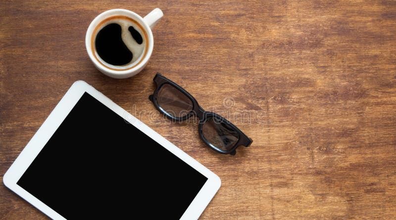 Tablet Pc Looking Like Ipad on Wood Table with Coffee and Black Glasses ...