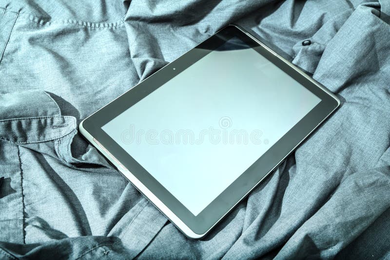 Tablet PC on a shirt stock photo. Image of material, outfit - 33810976