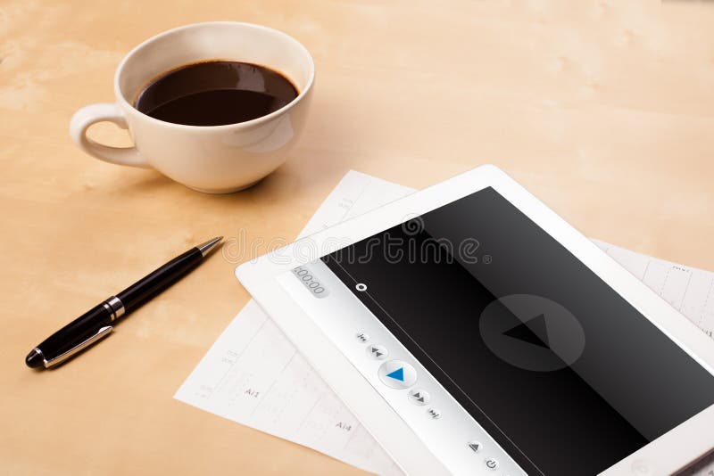 Tablet Pc Showing Media Player on Screen with a Cup of Coffee on Stock ...