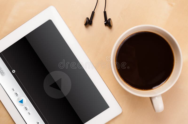 Tablet Pc Showing Media Player on Screen with a Cup of Coffee on Stock ...