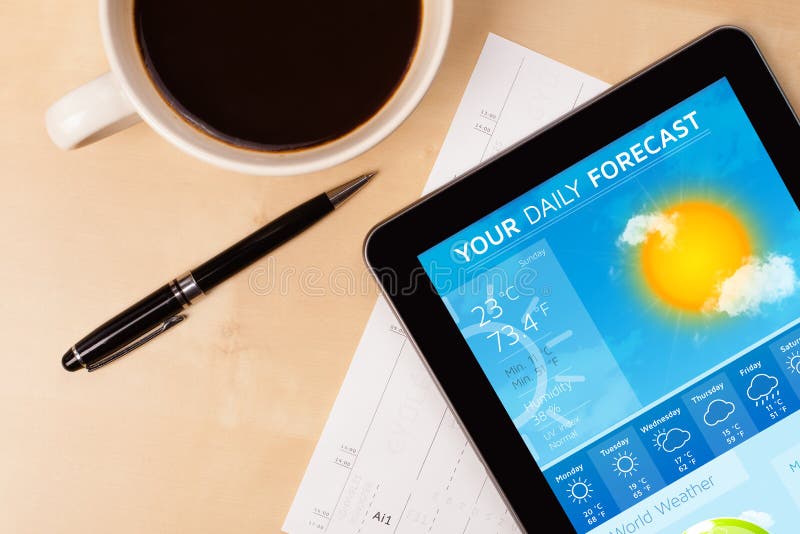 Tablet Pc Showing Weather Forecast on Screen with a Cup of Coffee on a ...