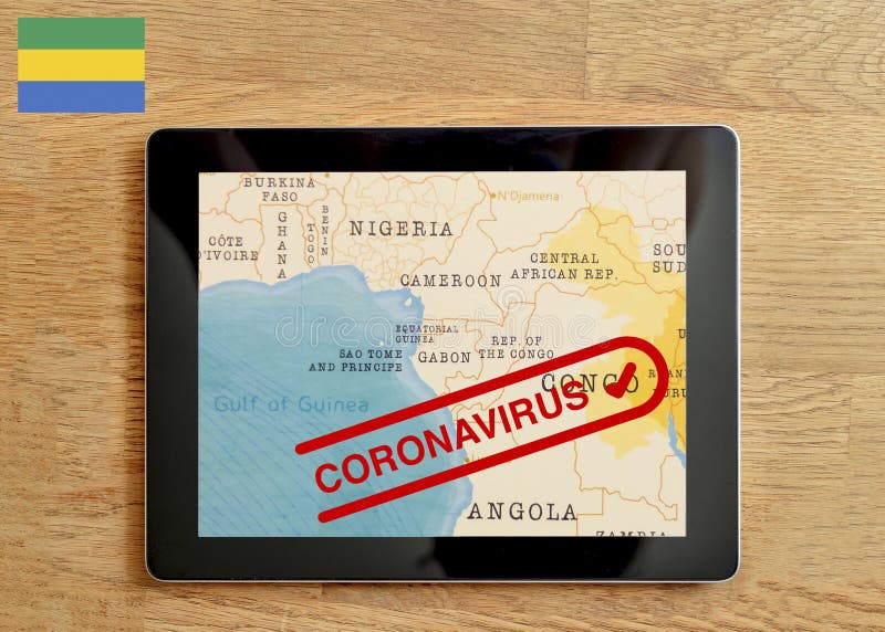 A Tablet PC Which is Displayed with Map of Gabon and Coronavirus Text ...