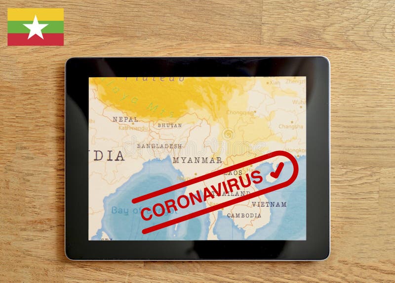 A Tablet PC Which is Displayed with Map of Myanmar and Coronavirus Text ...