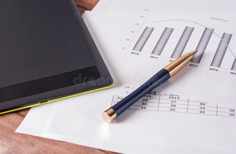 The Tablet and Pen on the Business Papers. Stock Photo - Image of ...