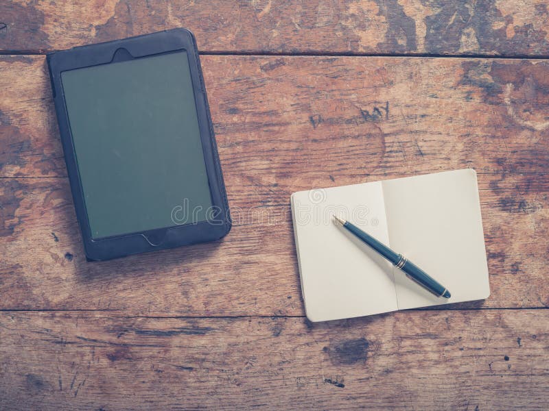 Tablet and Pen with Notepad on Table Stock Photo - Image of technology ...