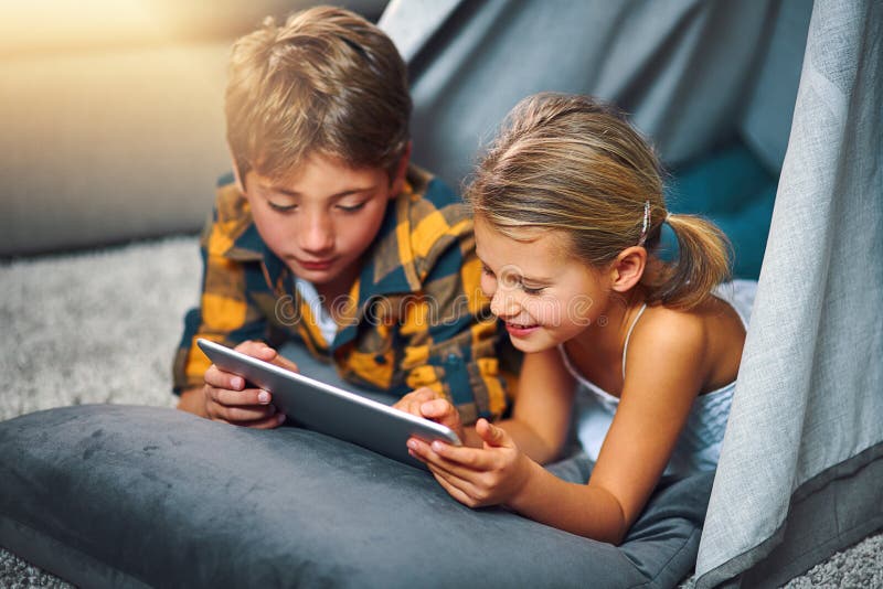 Tablet, Rest and Siblings in Tent in Home Playing Online Educational ...