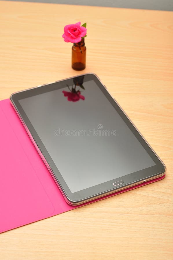 Tablet and a rose stock image. Image of brown, monitor - 70049335