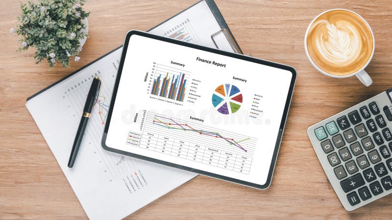 Tablet Screen Display with Charts and Reports on Office Desk Workplace ...
