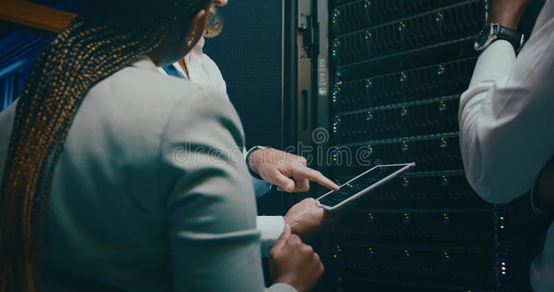 Tablet Screen, Hand and Discussion in Server Room for Maintenance, Code ...