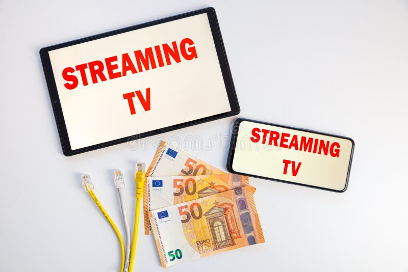 Tablet and Smartphone with `streaming Tv` Text, with Cables and Money ...