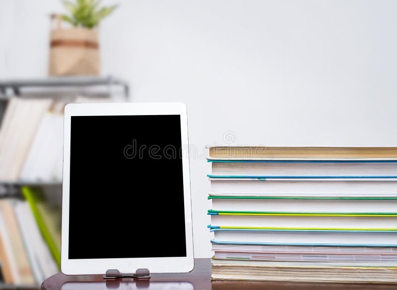 Tablet and Stack of Books on Table Stock Image - Image of bookcase ...