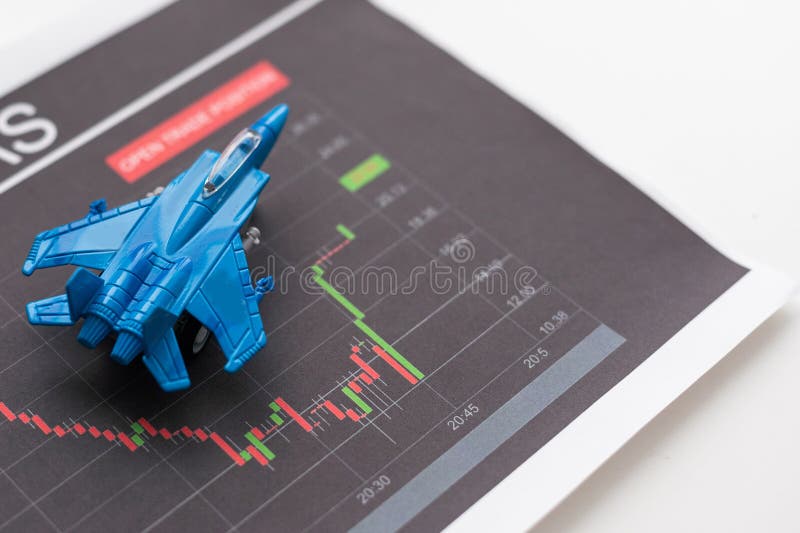 Tablet with Stock Data on Table and a Toy Airplane Stock Image - Image ...