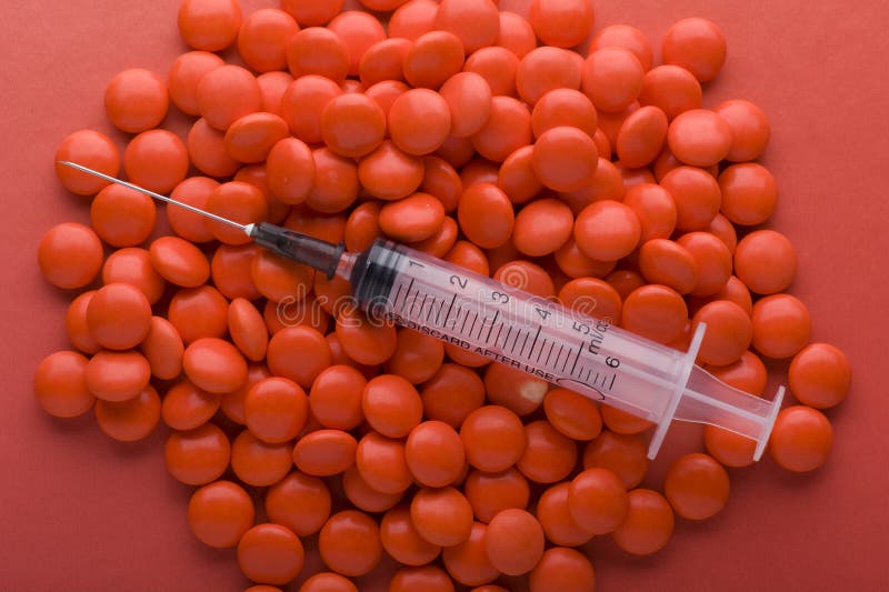 Tablet and syringe on red stock photo. Image of illness - 12334986