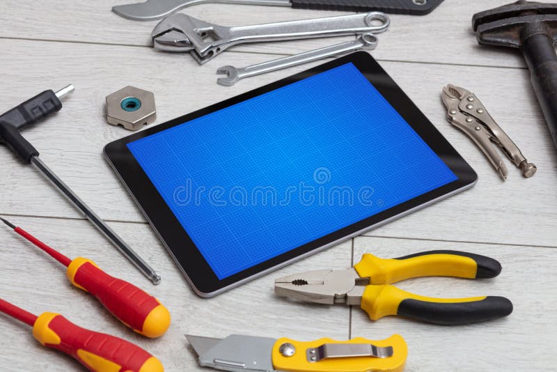 Tablet with Tools and Grid Screen Concept Stock Photo - Image of ...