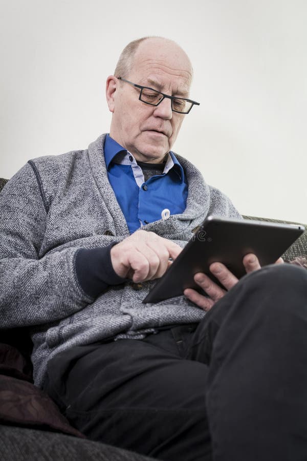 Tablet user looks excited stock image. Image of chair - 169557463