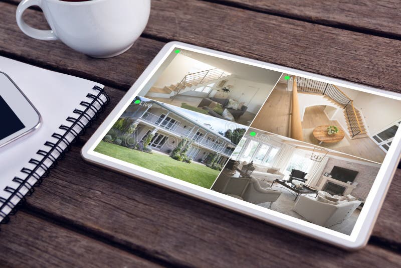 Tablet with View of Home from Security Cameras on Screen Lying on ...