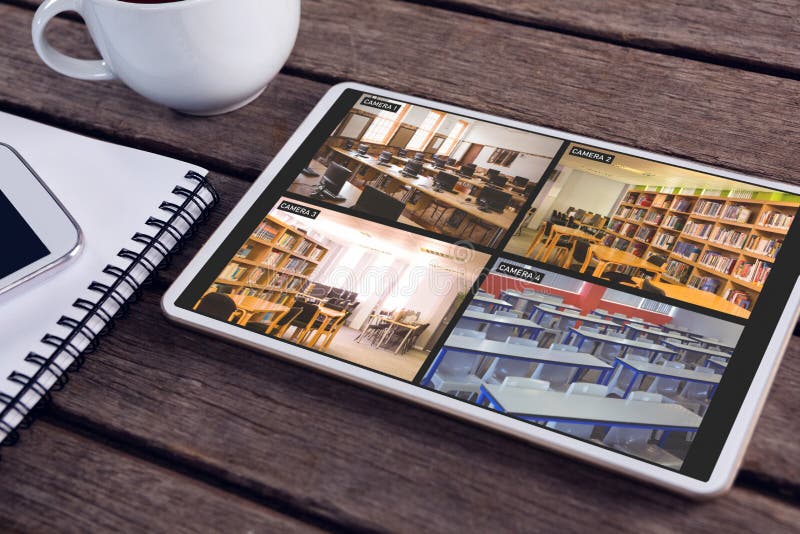 Tablet with View from Security Cameras at Library on Screen, Lying on ...