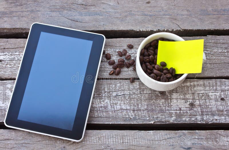 Tablet on wood background stock photo. Image of grained - 35637692
