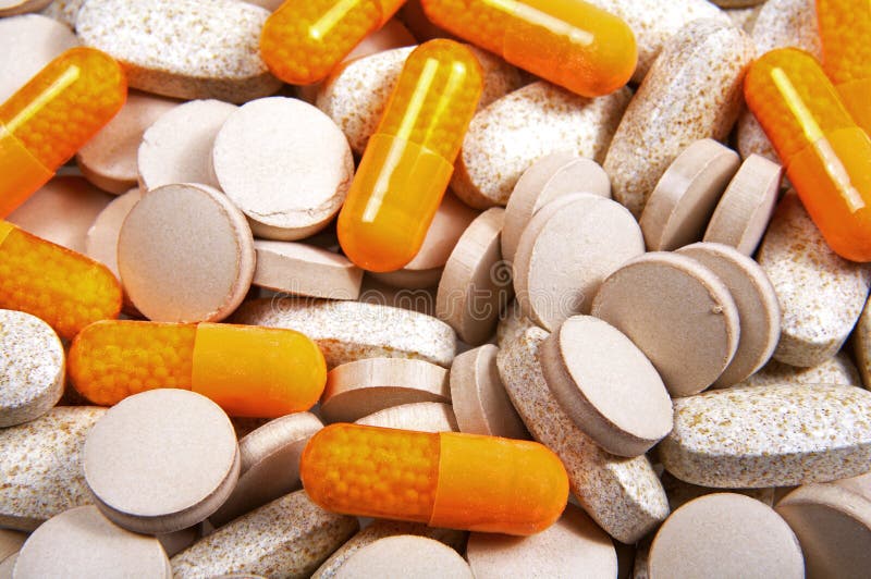 Tabletas de Brown foto de archivo. Imagen de trago, vitamina - 32291194