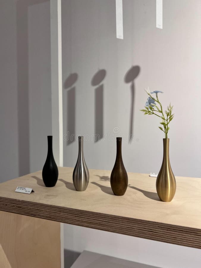 Tabletop Display Featuring an Assortment of Decorative Vases in a Range ...