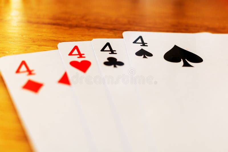 Tabletop with Four Card Suits Arranged in an Alternating Pattern Stock ...