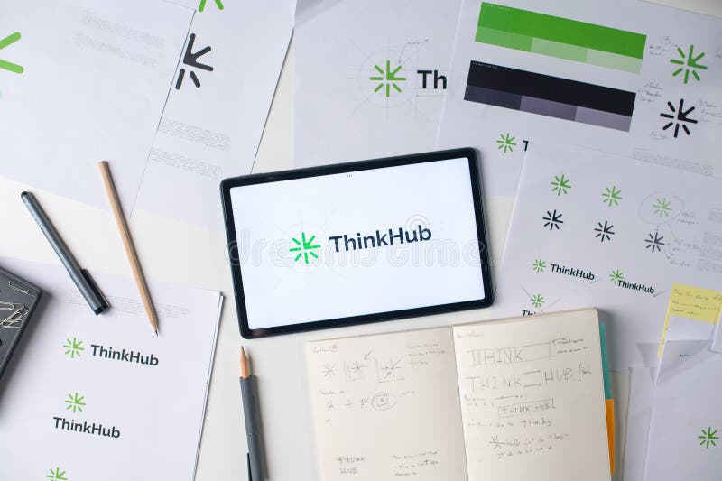 Tabletop View of a Logo Design Process, Featuring Sketches, Color ...