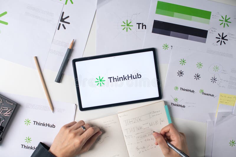 Tabletop View of a Logo Design Process, Featuring Sketches, Colour ...