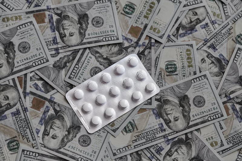 Tablets Close-up on the Background of Money Stock Photo - Image of ...