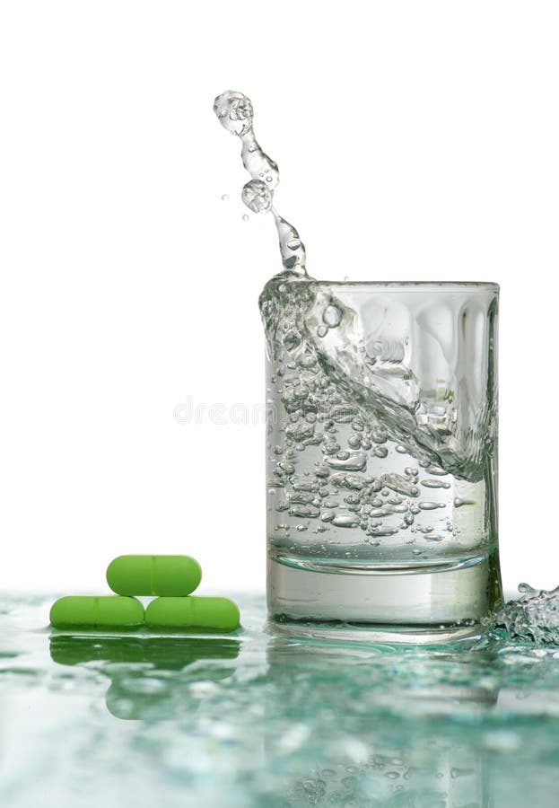 Tablets and glass of water stock image. Image of recovery - 24532143