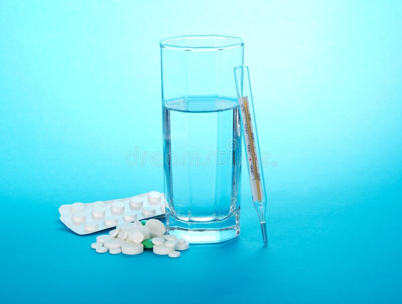Tablets, Glass with Water and the Mercury Stock Image - Image of ...
