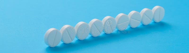 Tablets Lined Up in Row on Blue Background Panoramic Banner Stock Photo ...