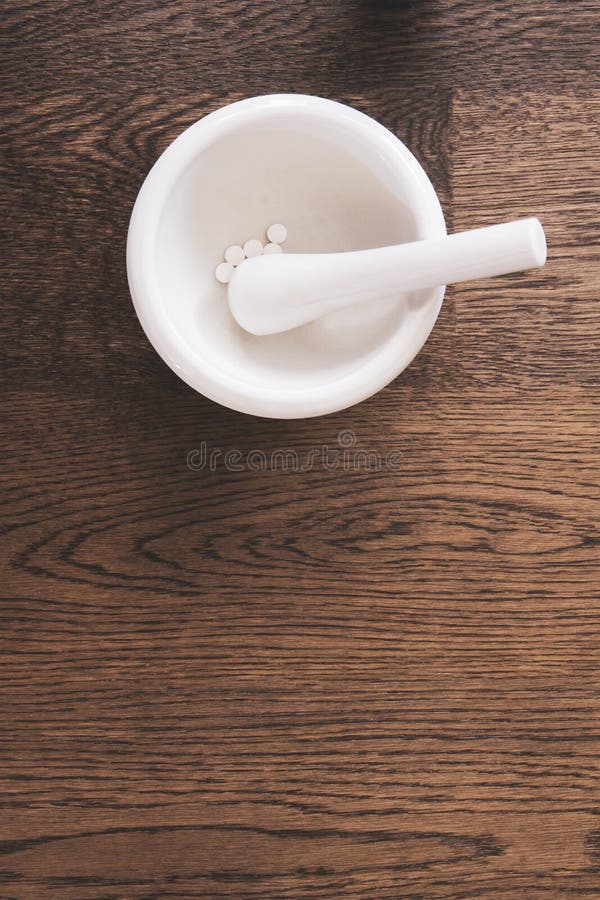 Tablets in a Mortar Being Crushed with Pestle for a Compound Stock ...