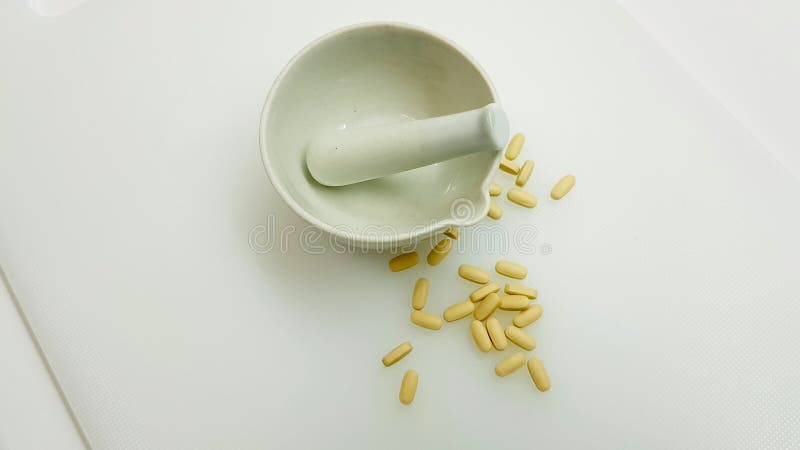 Tablets and mortar stock photo. Image of medicine, drug - 138216480