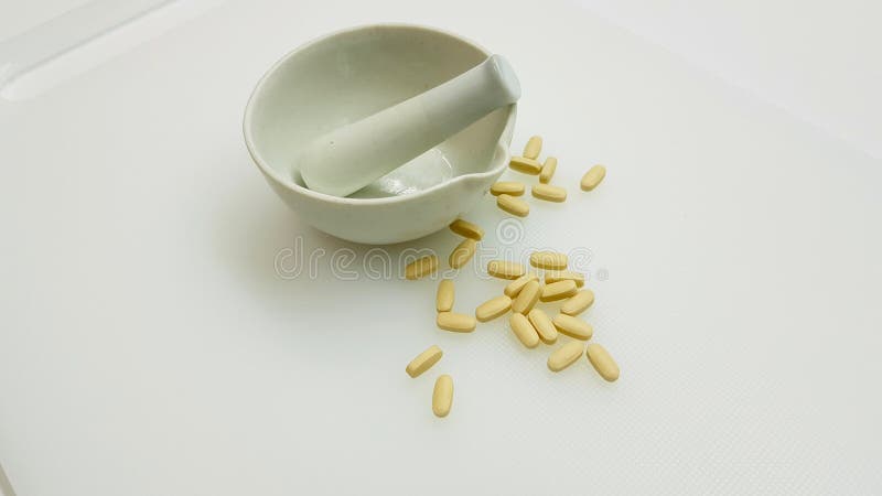 Tablets in a Mortar Being Crushed with Pestle for a Compound Stock ...