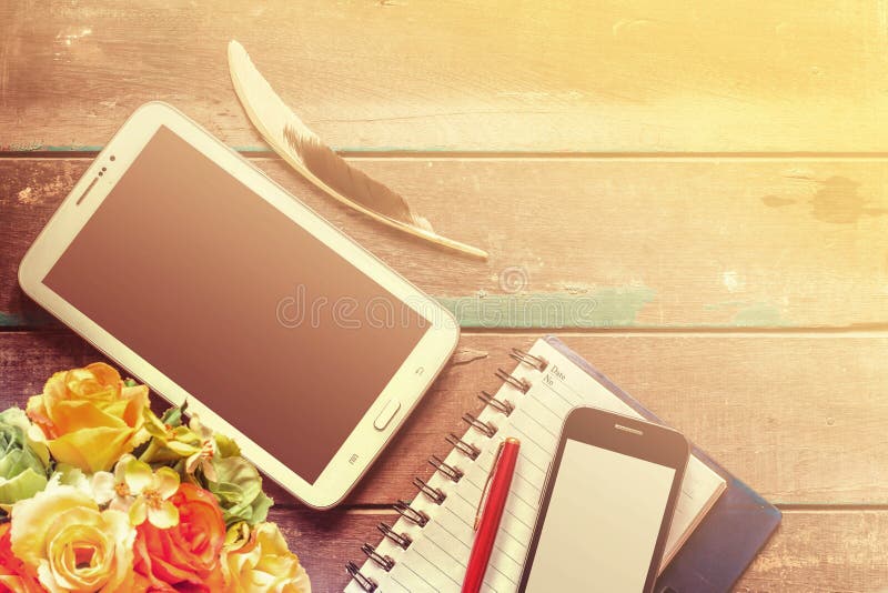 Tablets on the old wooden stock image. Image of device - 72524481