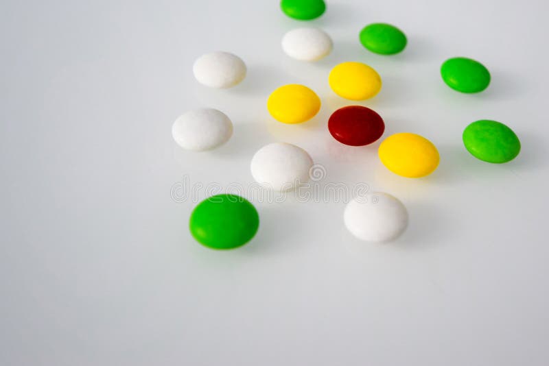 Tablets or Sweets, White and Colored on a White Table Stock Photo ...