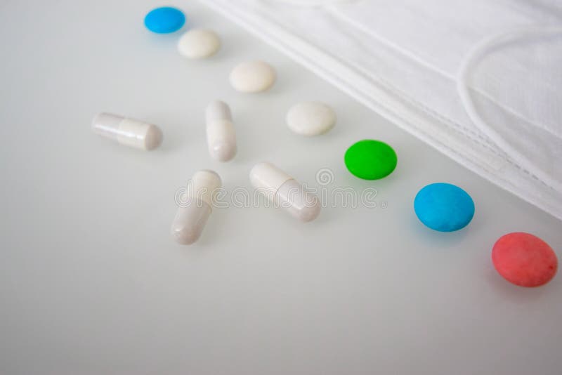 Tablets or Sweets, White and Colored on a White Table Stock Photo ...