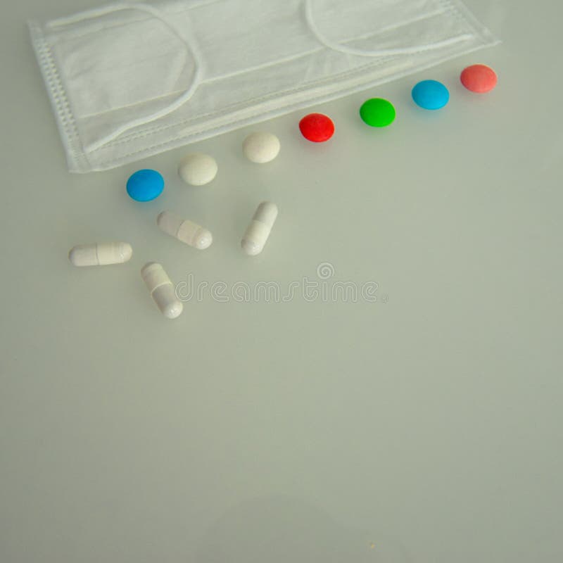 Tablets or Sweets, White and Colored on a White Table Stock Photo ...