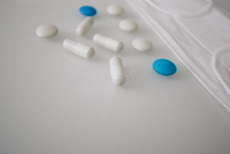 Tablets or Sweets, White and Colored on a White Table Stock Photo ...