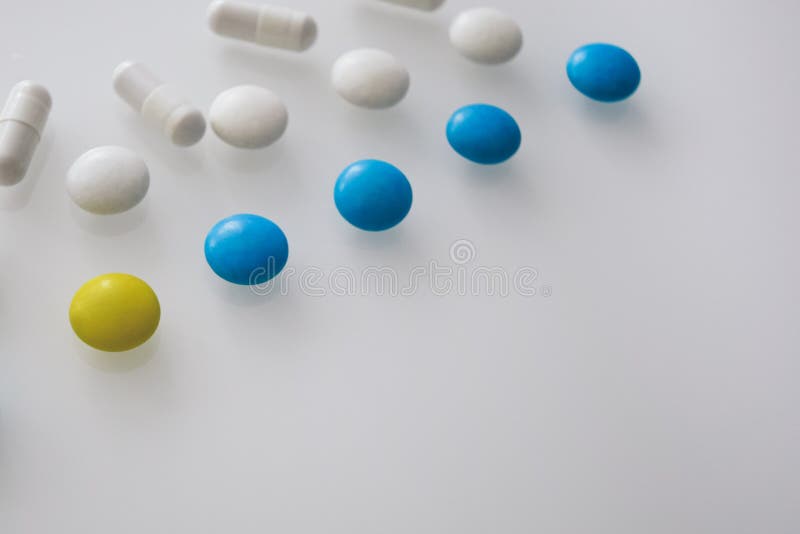 Tablets or Sweets, White and Colored on a White Table Stock Photo ...