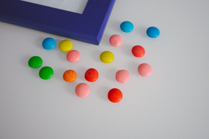 Tablets or Sweets, White and Colored on a White Table Stock Photo ...