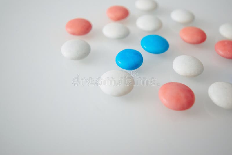 Tablets or Sweets, White and Colored on a White Table Stock Photo ...