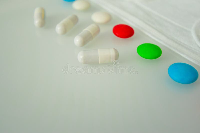 Tablets or Sweets, White and Colored on a White Table Stock Image ...